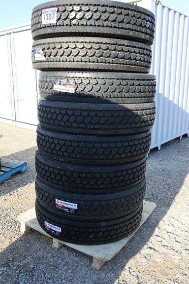 8 - 11R24.5 16 PLY DRIVE TIRES - CLOSED SHOULDER - Shackelton Auctions Inc.