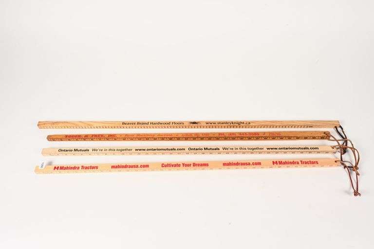 4 ADVERTISING MEASURING WALKING STICKS - Shackelton Auctions Inc.