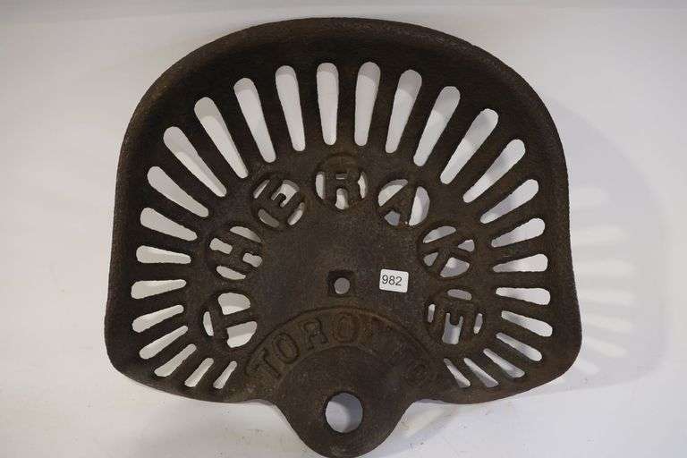 CAST IRON THE RAKE TORONTO TRACTOR SEAT - Shackelton Auctions Inc.