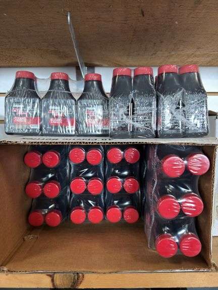 48 - 100ML RED ARMOUR 2 STROKE OIL - Shackelton Auctions Inc.