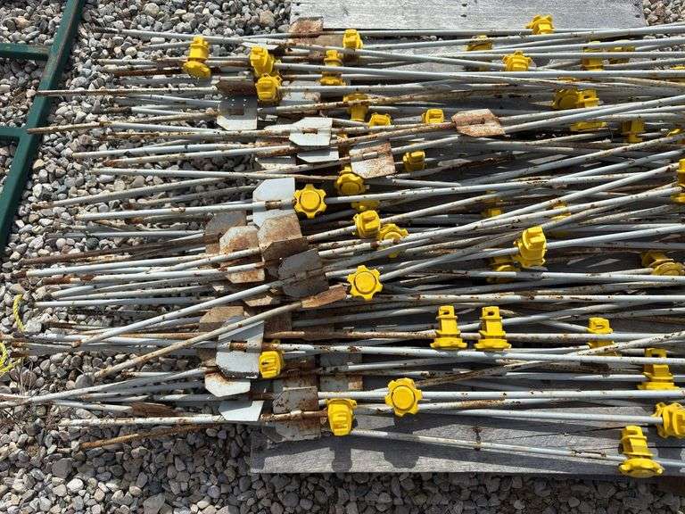 SKID OF APPROX. 60 - 4' ELECTRIC FENCE POSTS - Shackelton Auctions Inc.