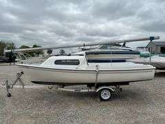 SIREN 17' SAILBOAT WITH EZ LOADER TRAILER - Shackelton Auctions Inc.