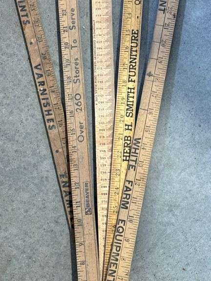 GROUP OF ADVERTISING YARD STICKS - Shackelton Auctions Inc.