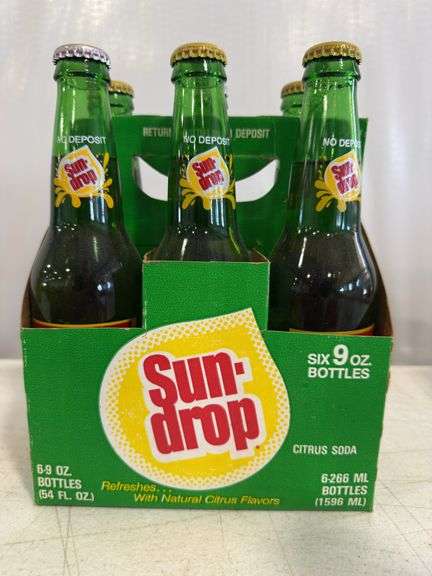 SUNDROP POP BOTTLES WITH CARRIER - Shackelton Auctions Inc.