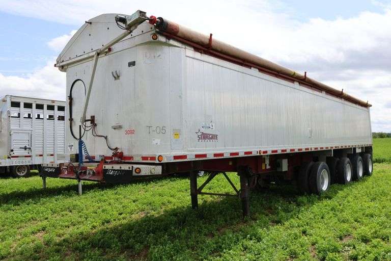 2009 STARGATE 4 AXLE ALUMINUM DUMP TRAILER - Shackelton Auctions Inc.