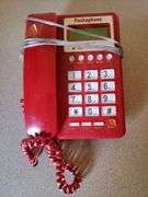 Red push-dial landline phone - Wolfe Auction & Realty, LLC