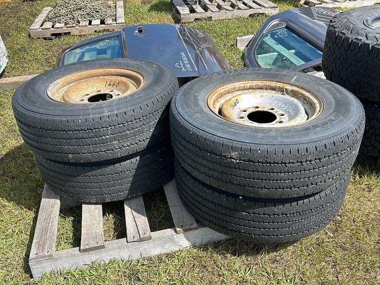 1990 Ford Rims & Tires LT245/75R16 - Wild Rose Auction Services