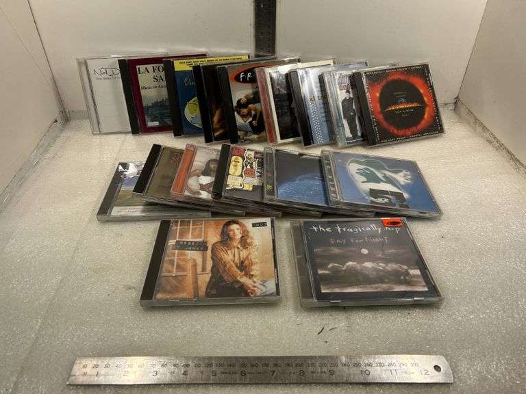 Box of assorted CD's & empty CD cases - Wild Rose Auction Services