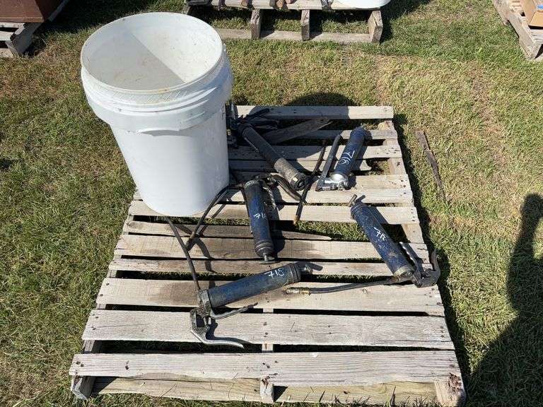 Pallet w/ 5 Grease guns, & pail **Unreserved** - Wild Rose Auction Services