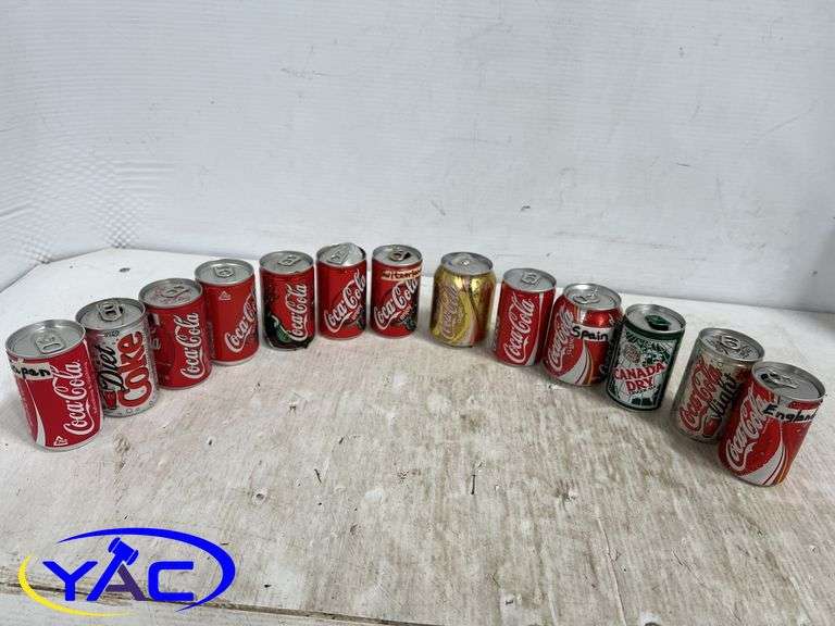 13- Coca Cola Cans - YAC Auctions