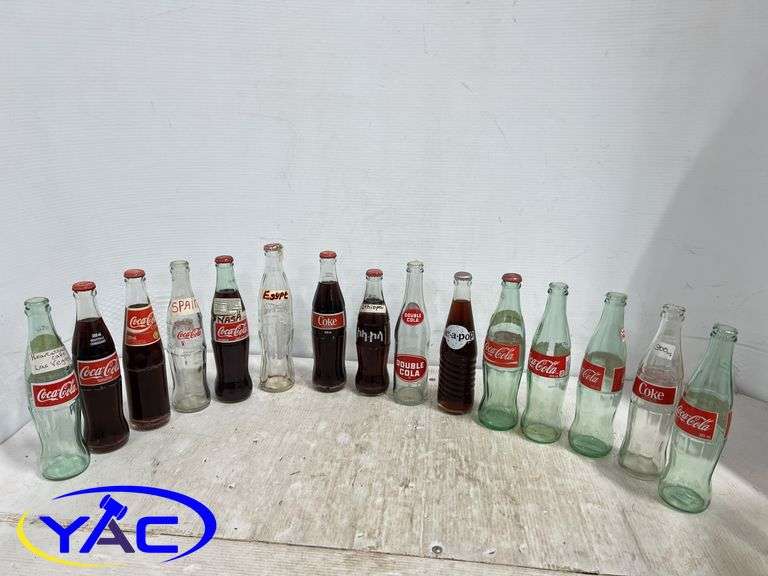 15- Coca Cola Bottles - YAC Auctions