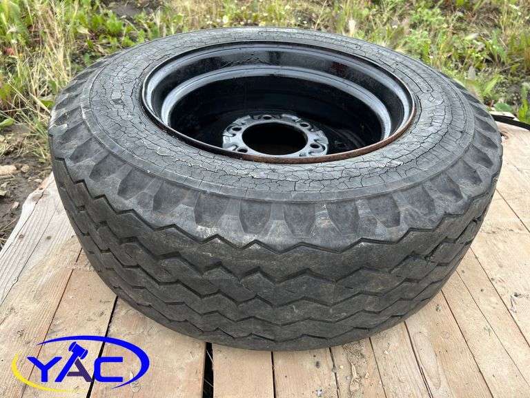 1 - 9.50 x 16.5 LT Tire On Rim - Tire Cracked ( See Photos ) - YAC Auctions
