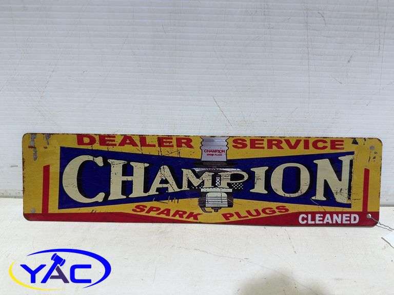 4" x 16" Metal Champion Spark Plug Door Sign - YAC Auctions