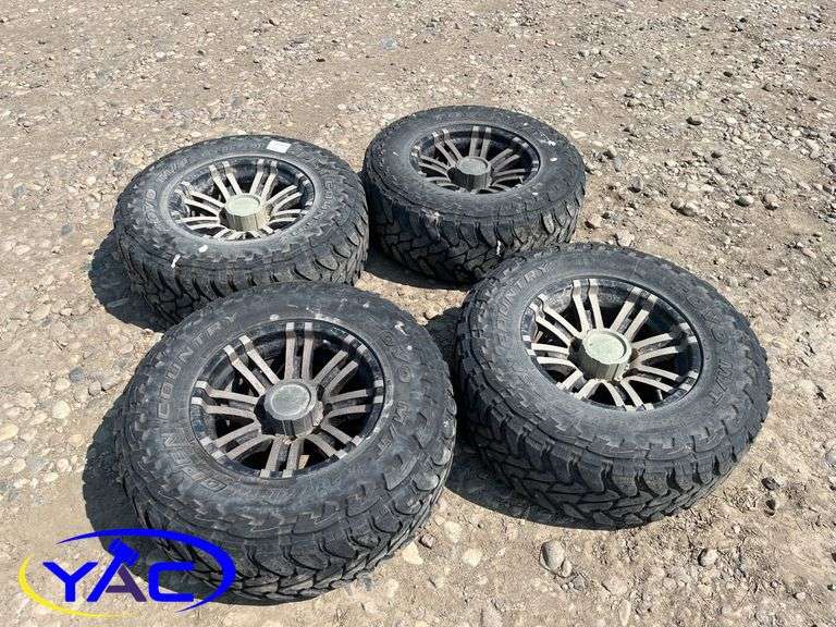 4- 17" 8 Bolt Dodge Rims 1 Damaged - YAC Auctions
