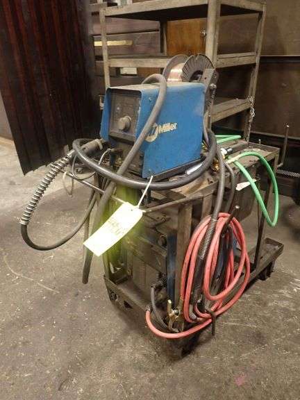 Miller Welding Cart w/ XMT 304 CCCV Welder - Yellow Tag Auctions